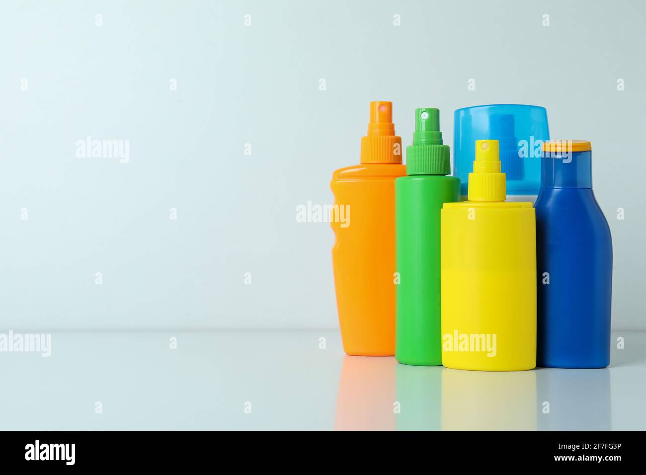 Blank bottles of sunscreen on white background Stock Photo - Alamy