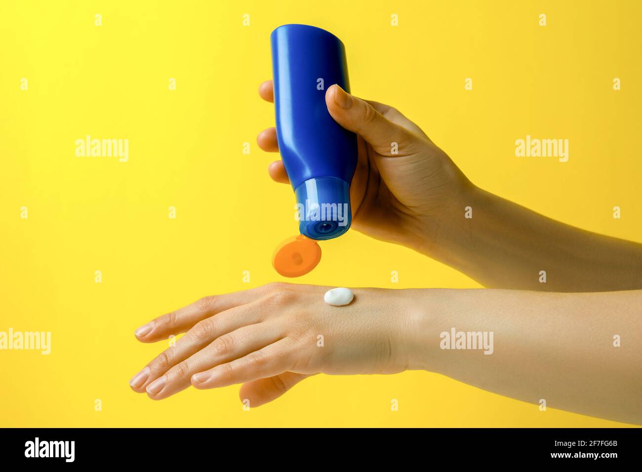 Applying sunscreen moisturizer cream female hi-res stock photography ...