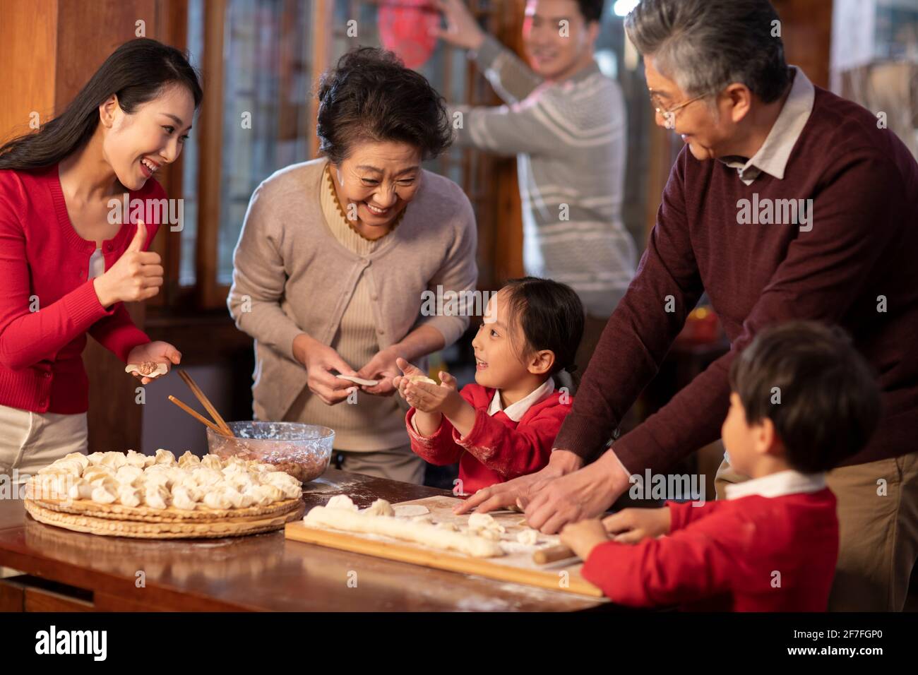 Happy family making dumplings Stock Photo - Alamy Happy family making dumplings Stock Photo - Alamy