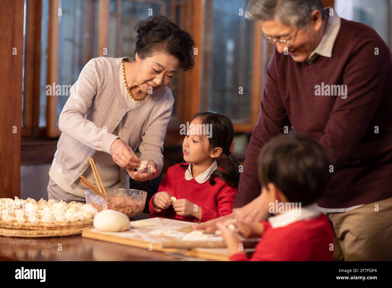 Happy family making dumplings Stock Photo - Alamy Happy family making dumplings Stock Photo - Alamy