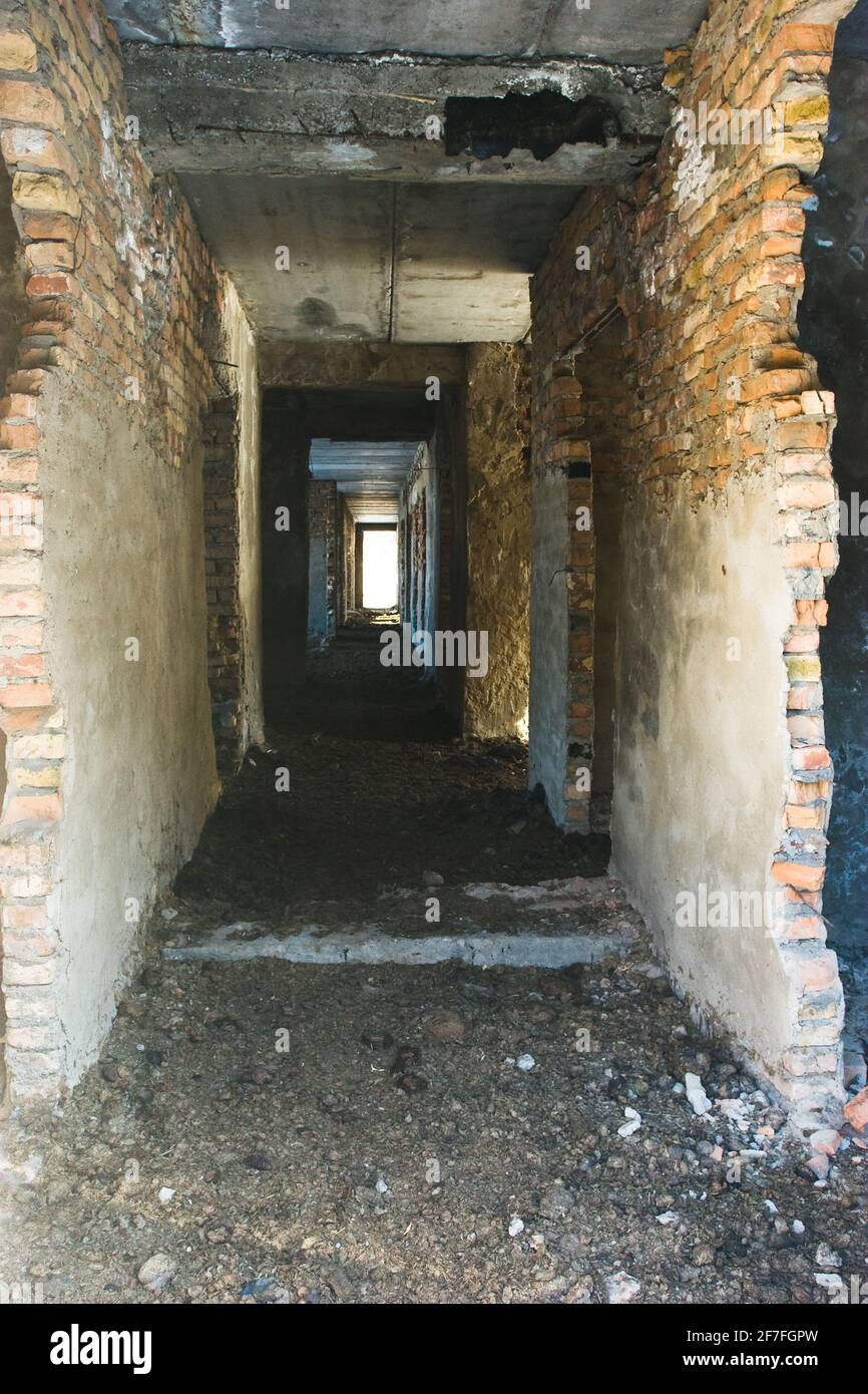 The corridor in the destroyed building Stock Photo - Alamy
