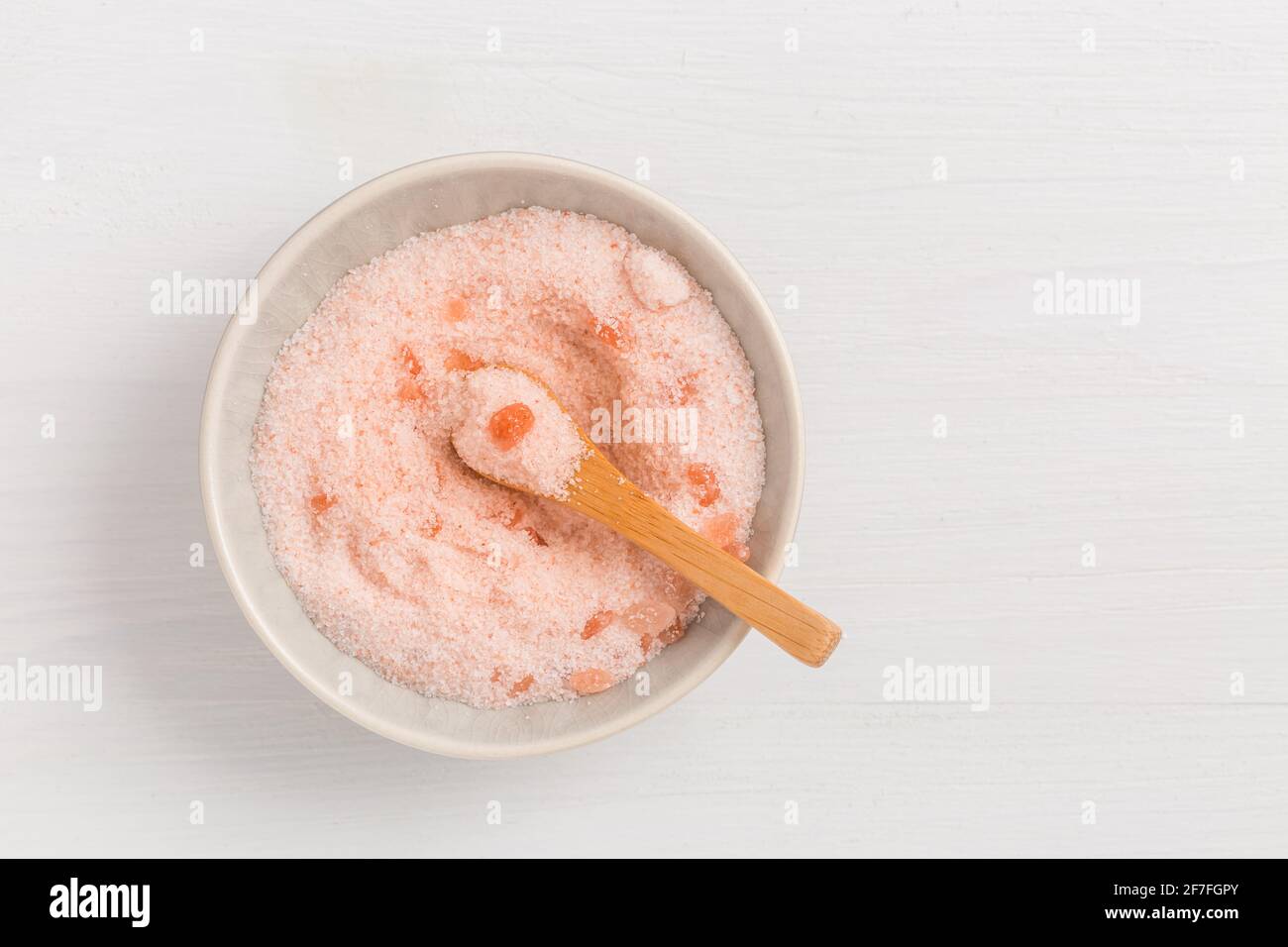 Organic Himalayan salt in bowl on white background Stock Photo - Alamy