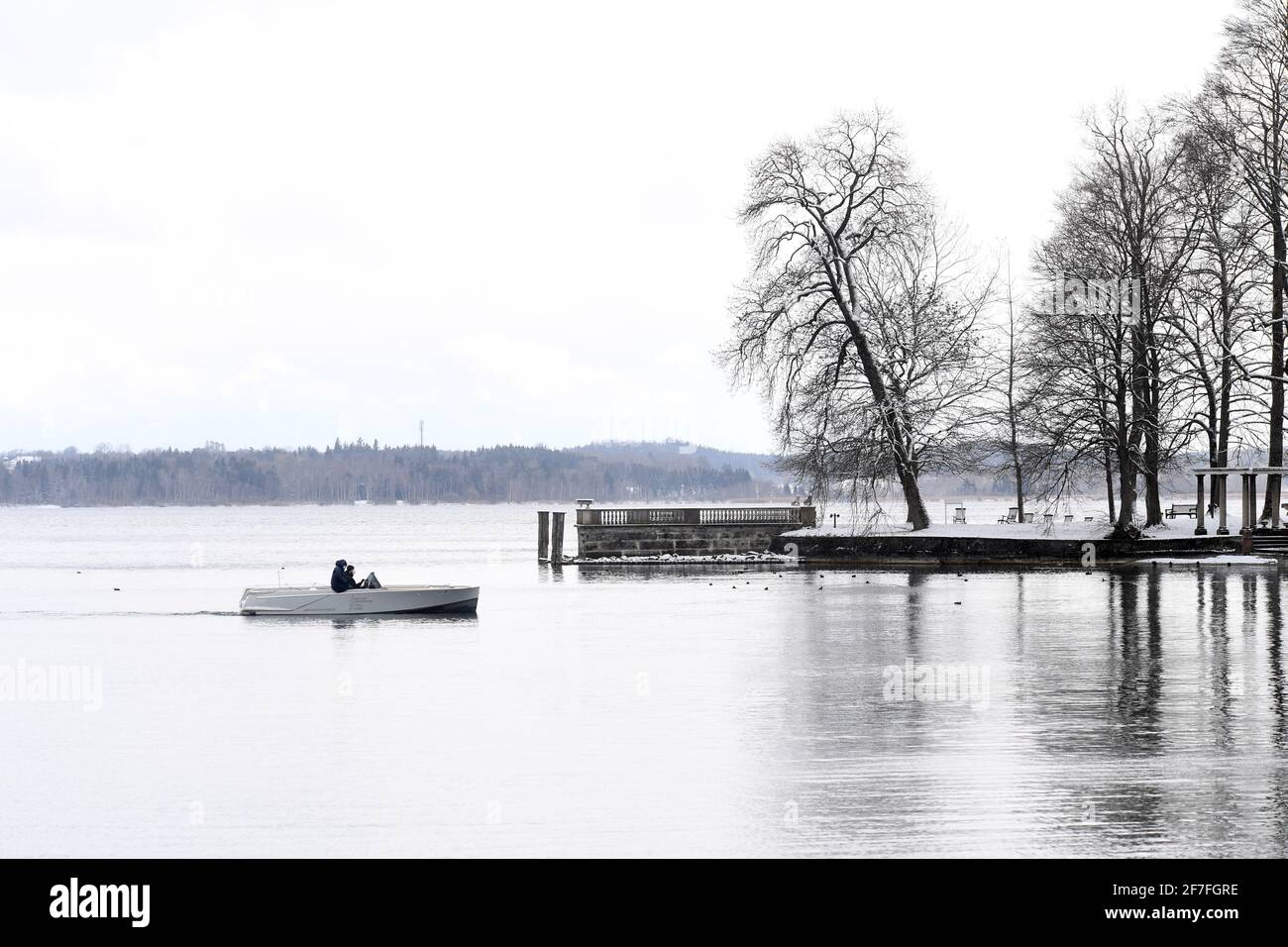 Tutzing, Germany. 07th Apr, 2021. A boat is sailing across the ...