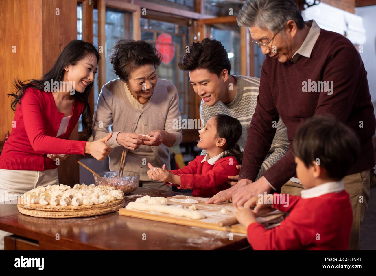 Happy family making dumplings Stock Photo - Alamy Happy family making dumplings Stock Photo - Alamy
