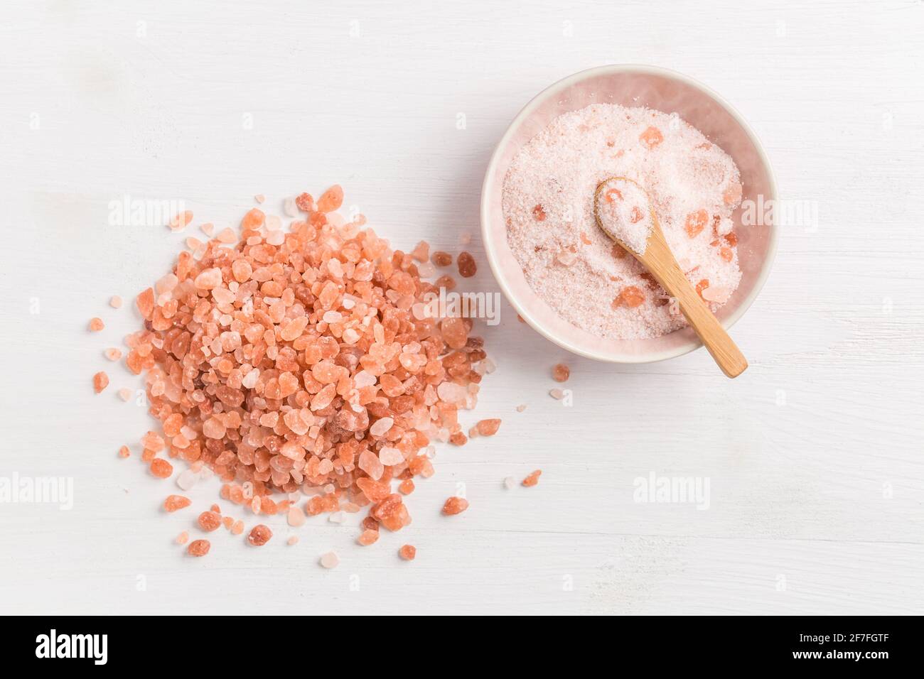 Organic Himalayan salt in bowl on white background Stock Photo - Alamy