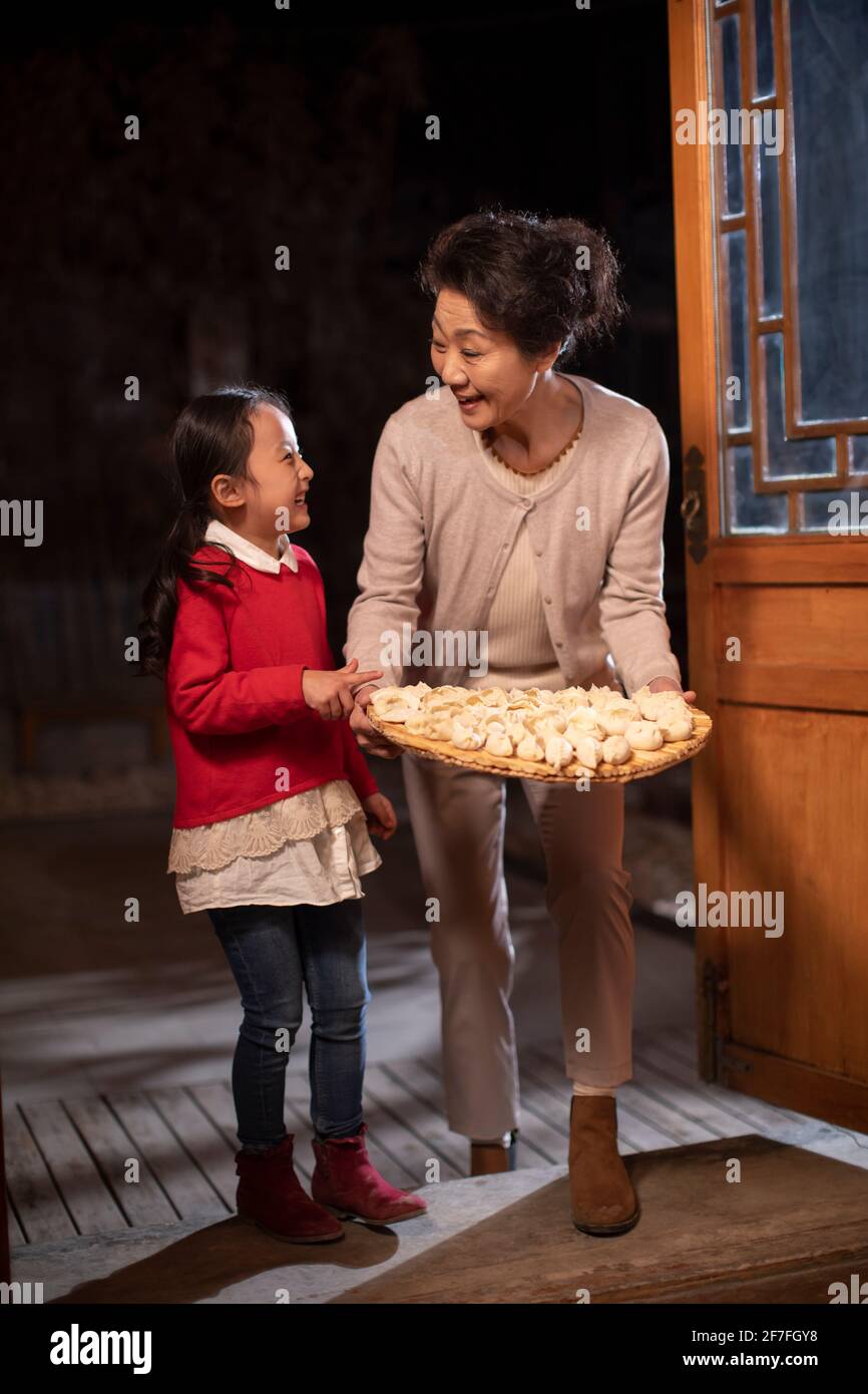 Happy family and dumplings Stock Photo - Alamy