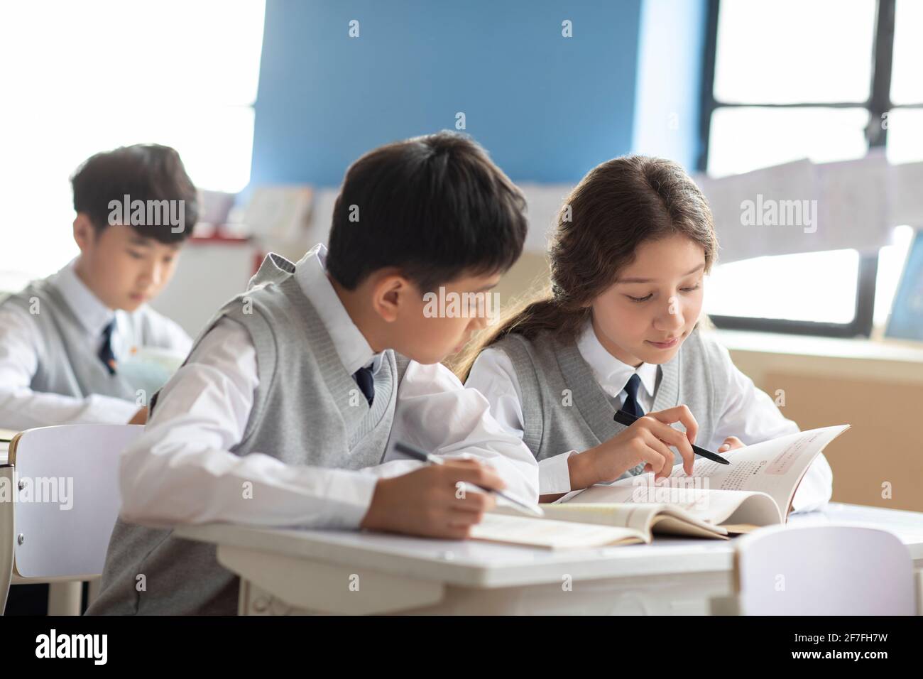 Students learning in classroom Stock Photo - Alamy