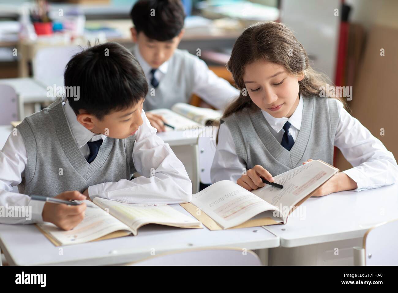 Students learning in classroom Stock Photo - Alamy