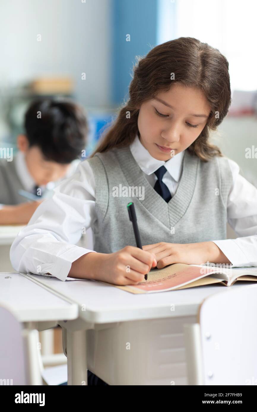 Students learning in classroom Stock Photo - Alamy