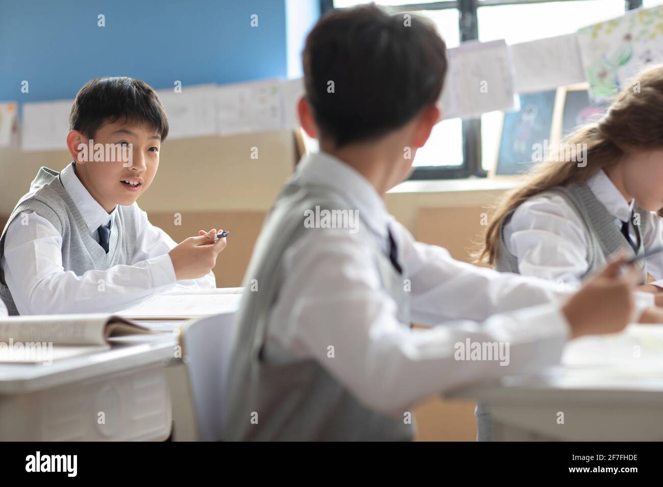 Students learning in classroom Stock Photo - Alamy