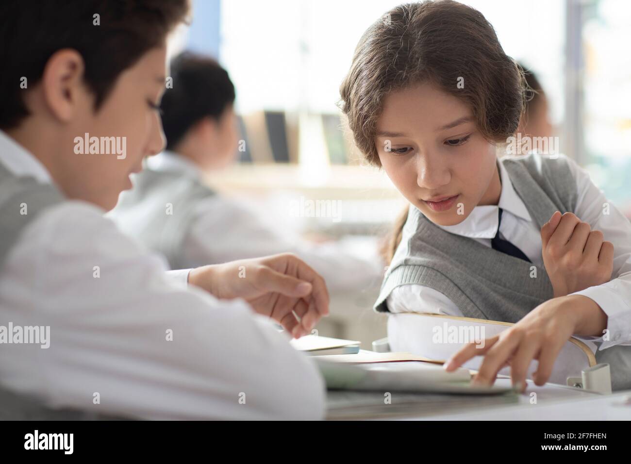 Students learning in classroom Stock Photo - Alamy