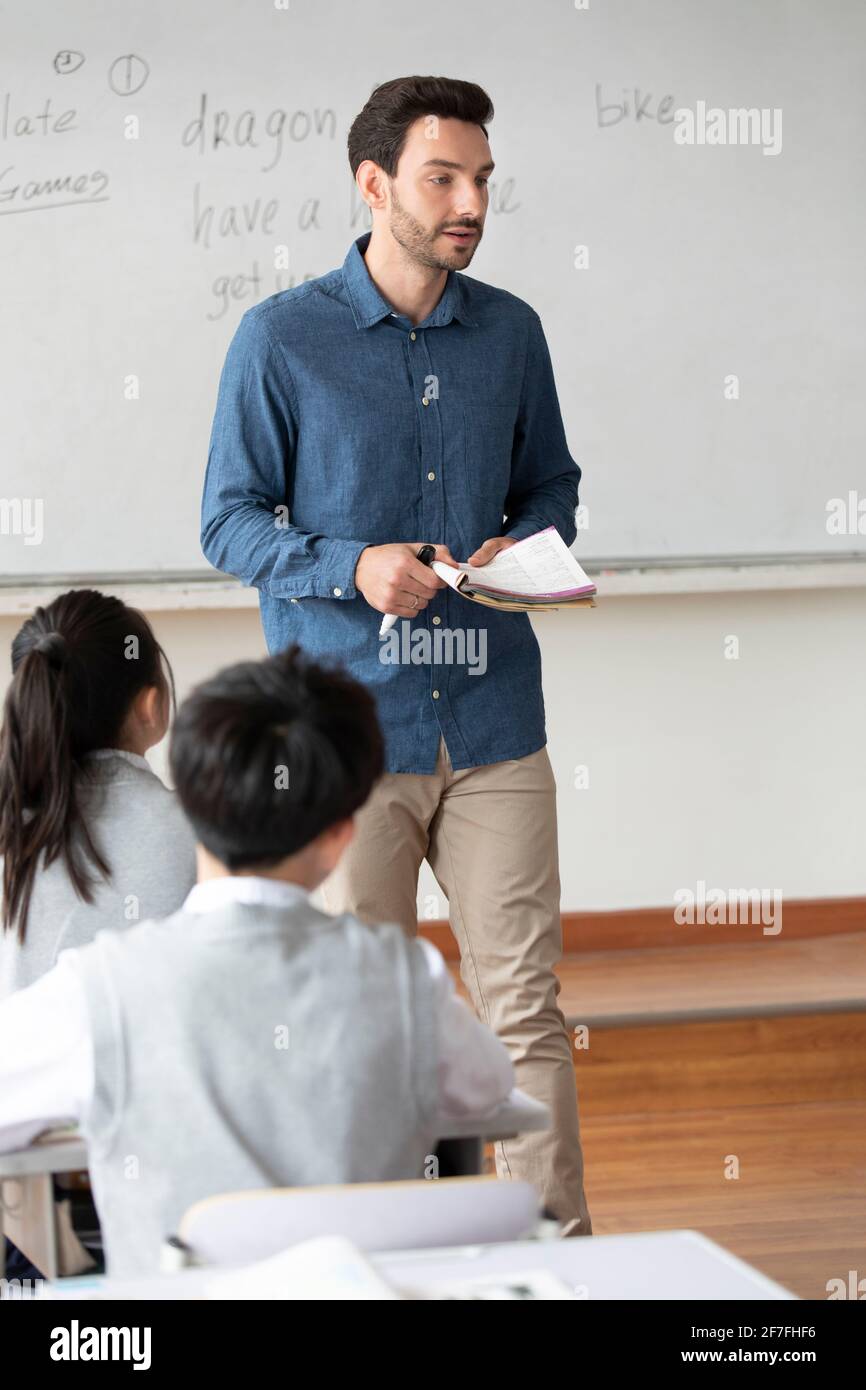 Young teacher teaching a class Stock Photo - Alamy