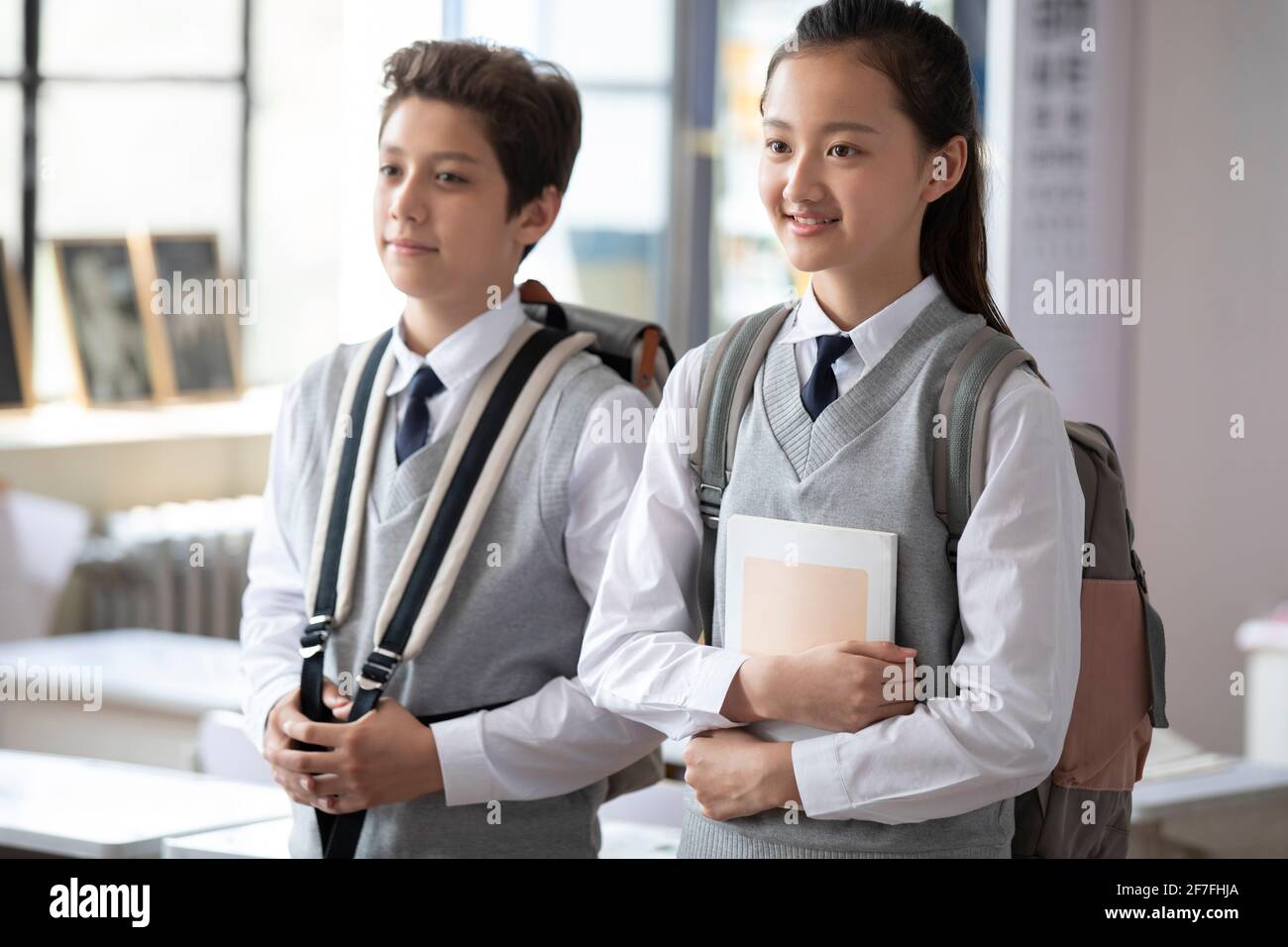 Students standing in classroom Stock Photo - Alamy