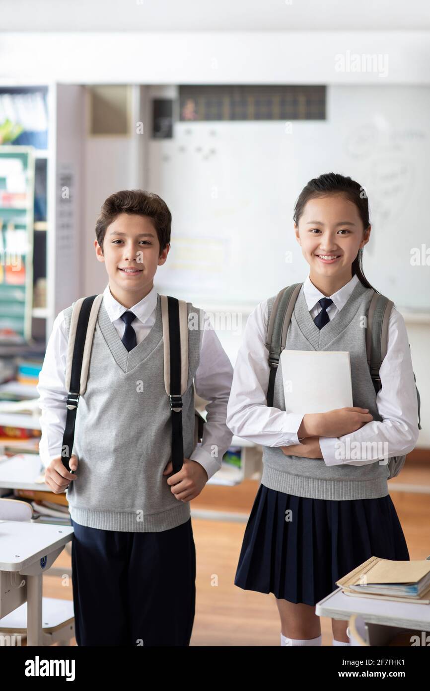 Students standing in classroom Stock Photo - Alamy
