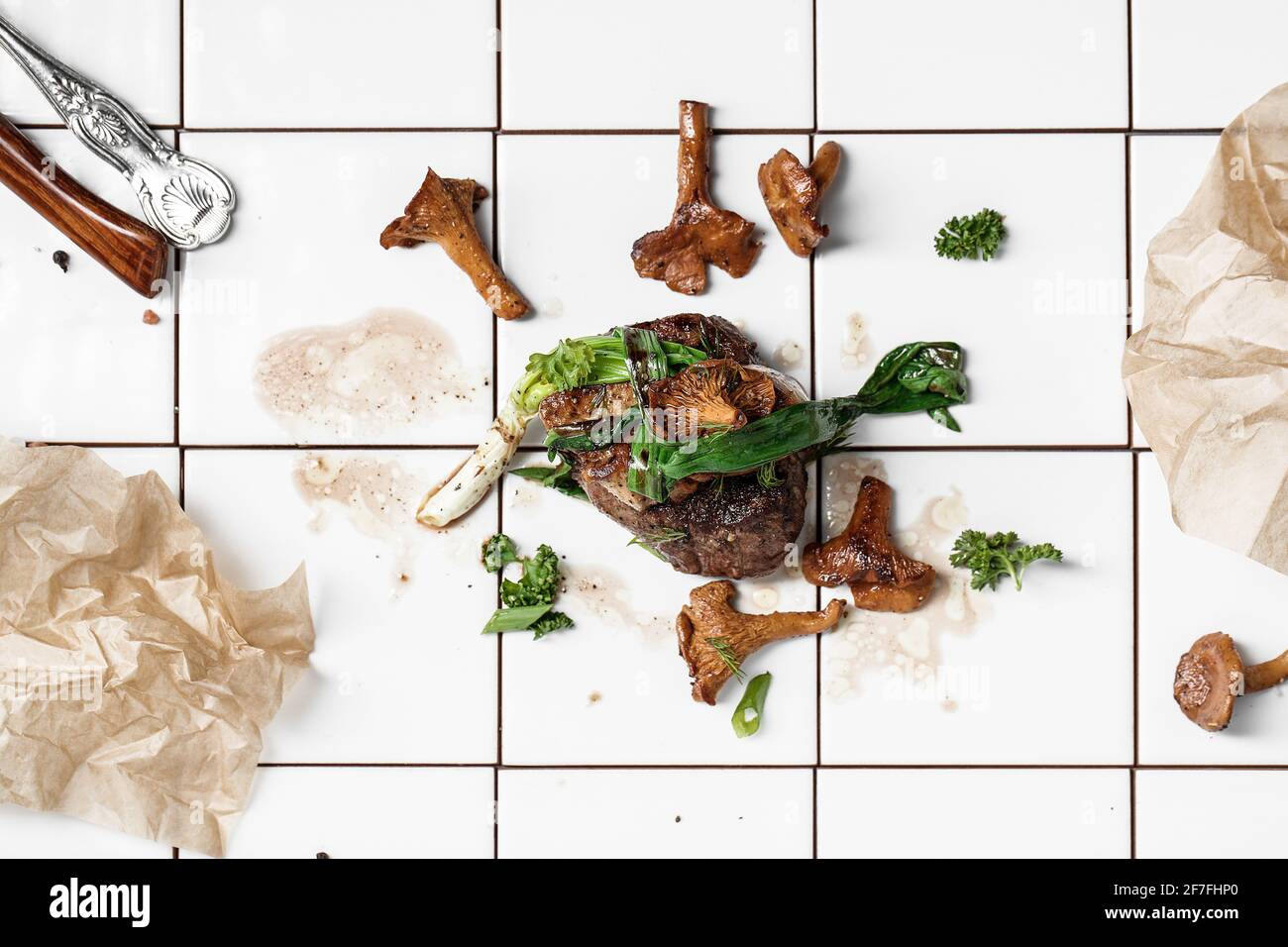 Grilled beef steak with chanterelles on white tiles background Stock ...