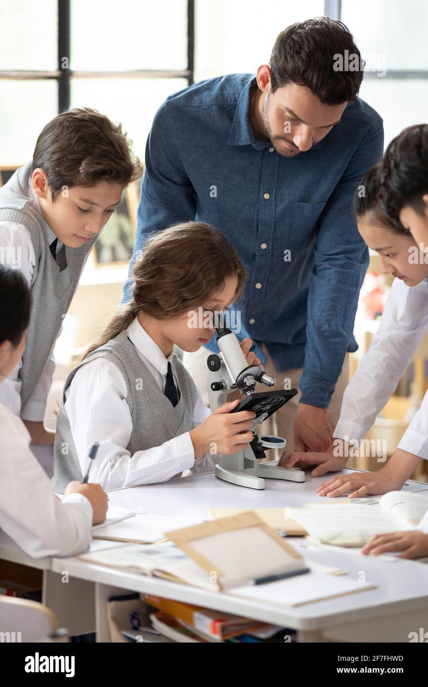 Microscope student ethnic hi-res stock photography and images - Alamy