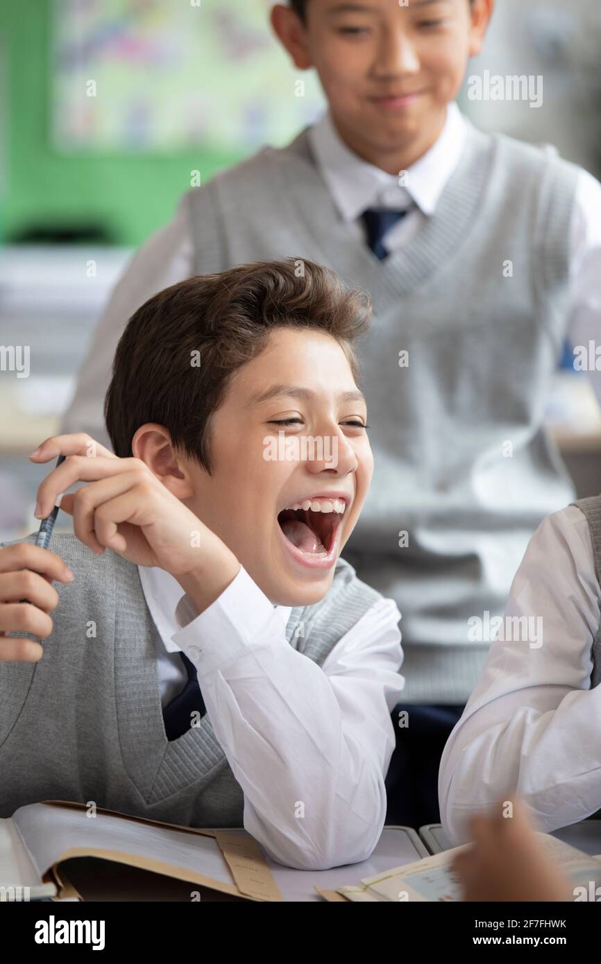 Uniform classroom laughing hi-res stock photography and images - Alamy