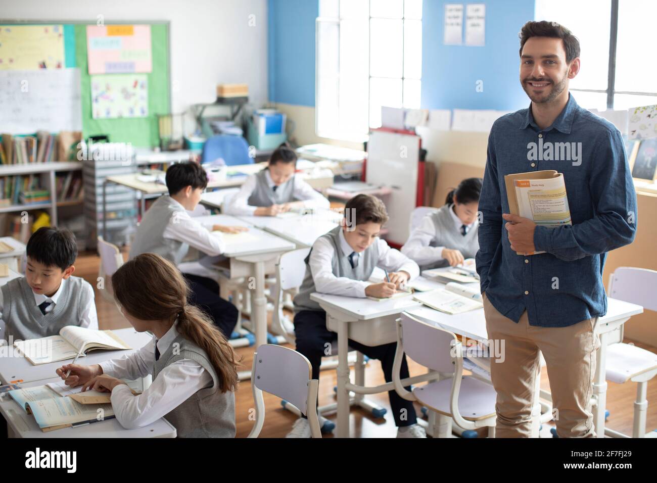 Young teacher teaching a class Stock Photo - Alamy
