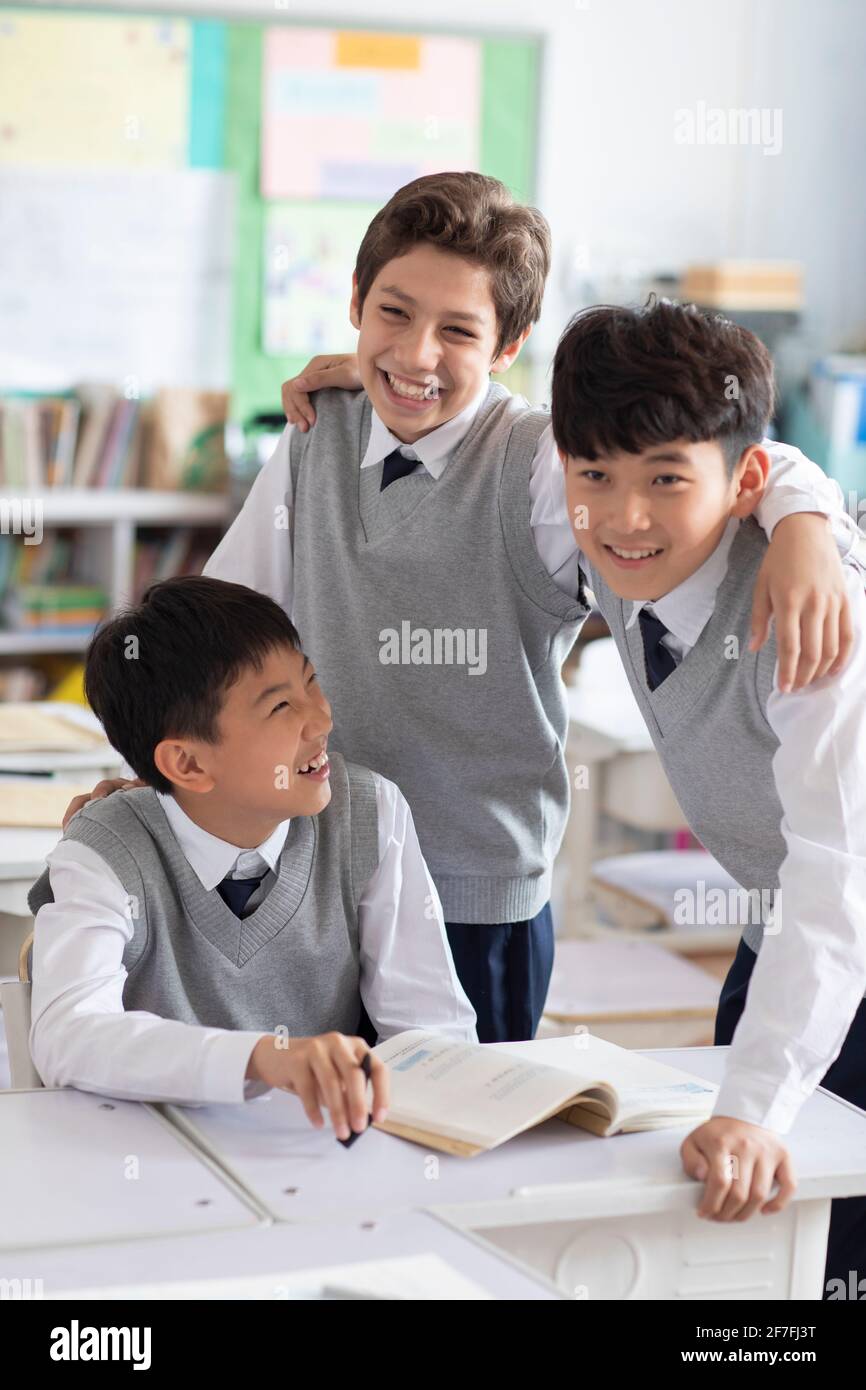 Uniform classroom laughing hi-res stock photography and images - Alamy