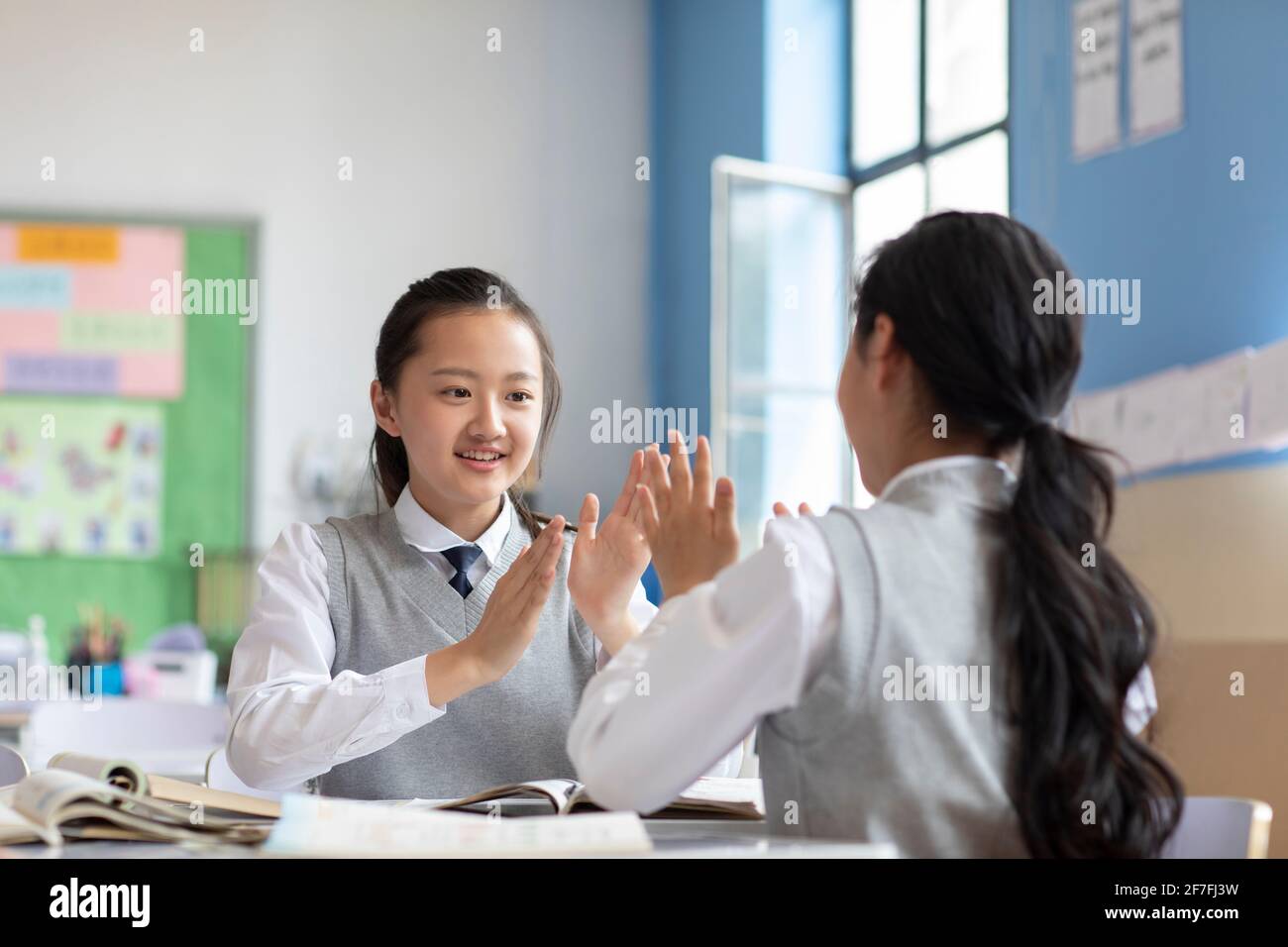 Students having fun in classroom Stock Photo - Alamy