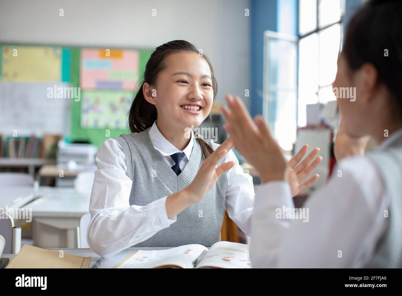 Students having fun in classroom Stock Photo - Alamy