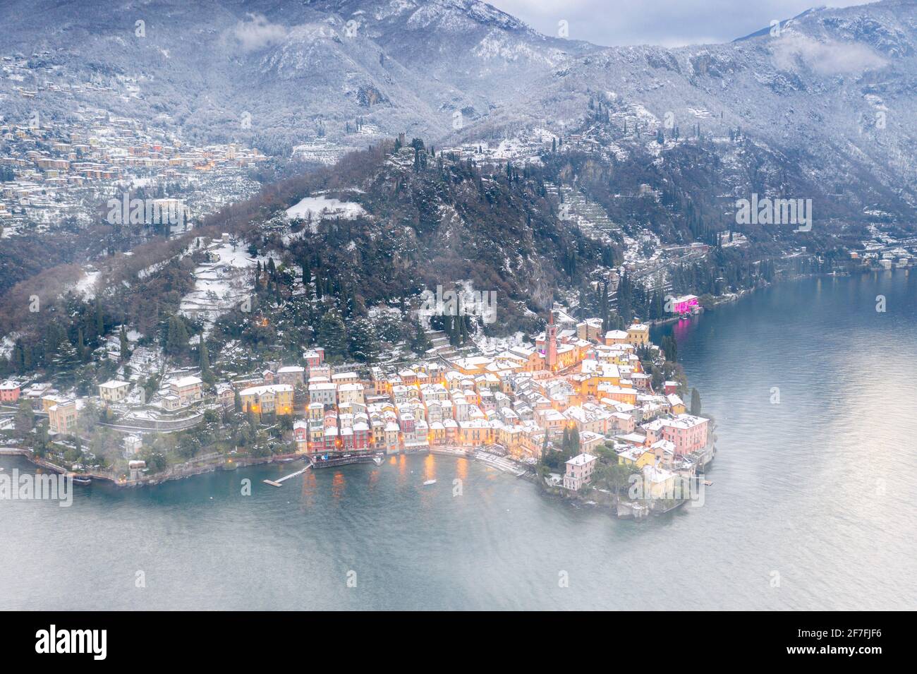 Romantic town of Varenna covered with snow, aerial view, Lake Como ...