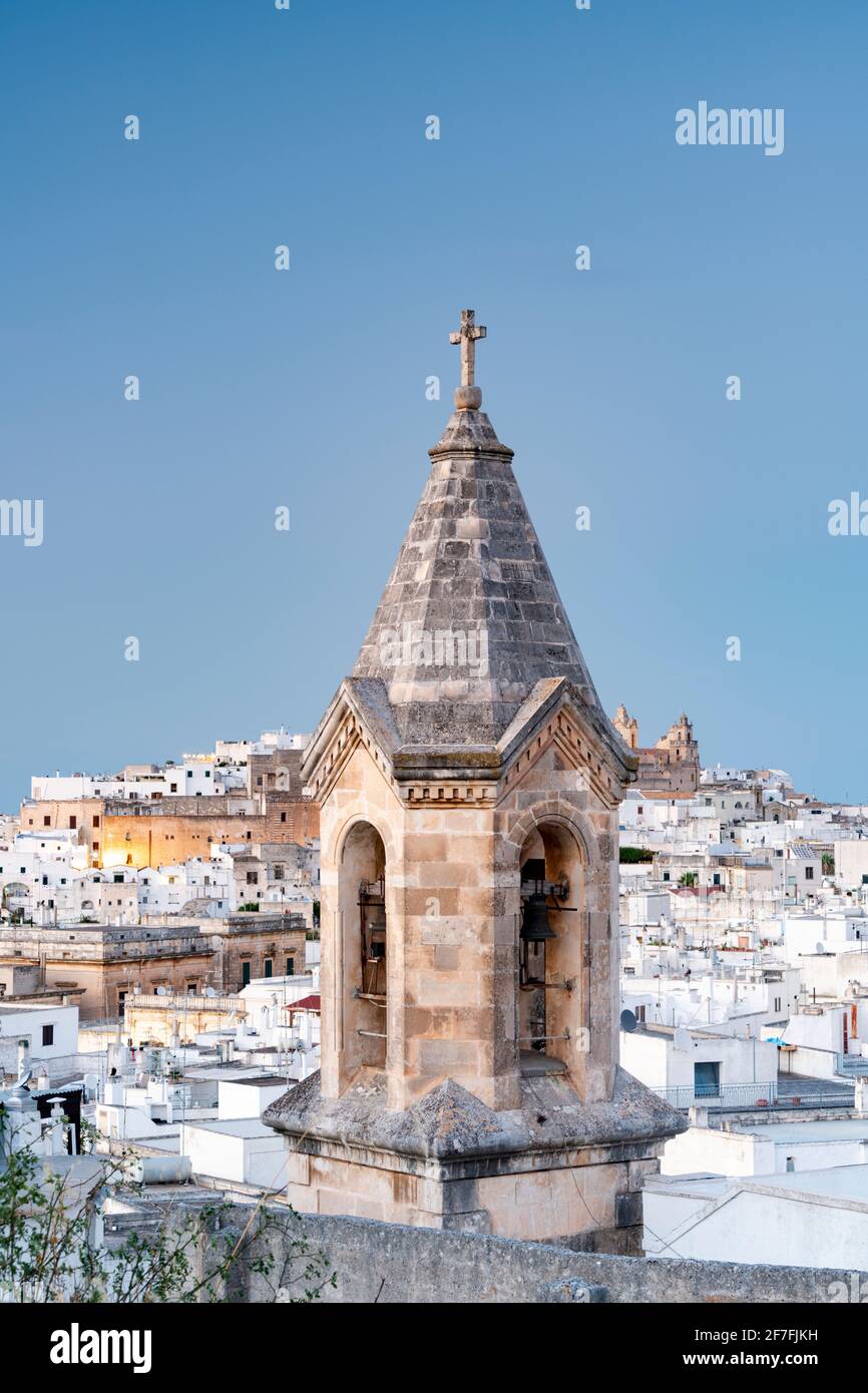 Medieval bell tower and whitewashed houses in the old town of Ostuni ...