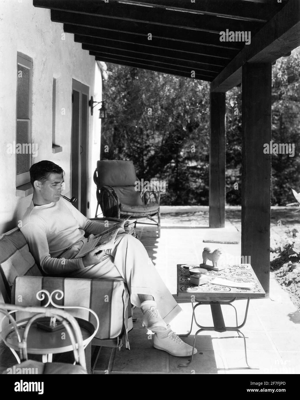 CLARK GABLE 1932 Candid Portrait on Terrace of his Home smoking Pipe by ...