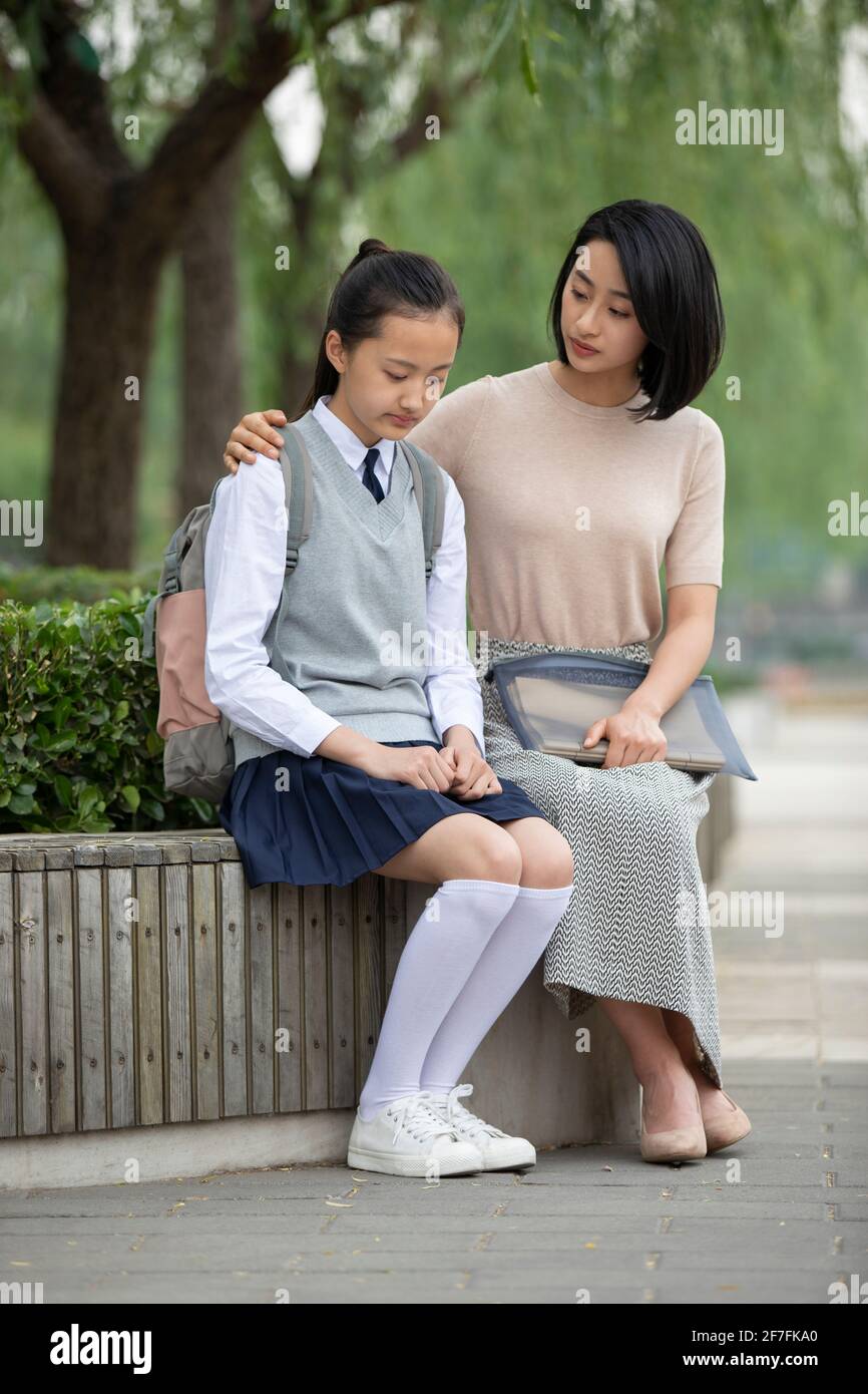 Teacher consoling student Stock Photo - Alamy