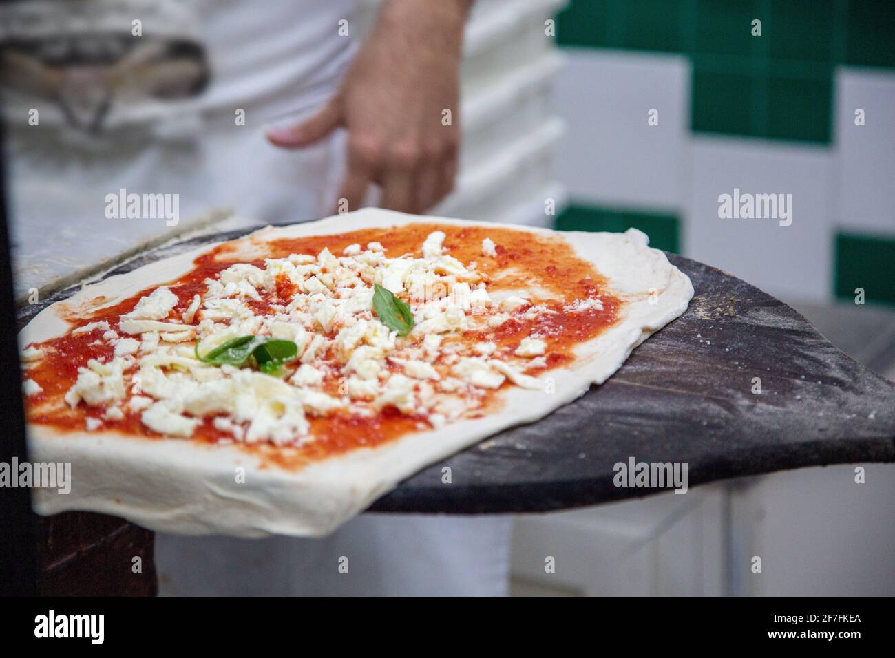 Cooking pizza Margherita in Pizzeria da Michelle in Naples, Italy Stock ...