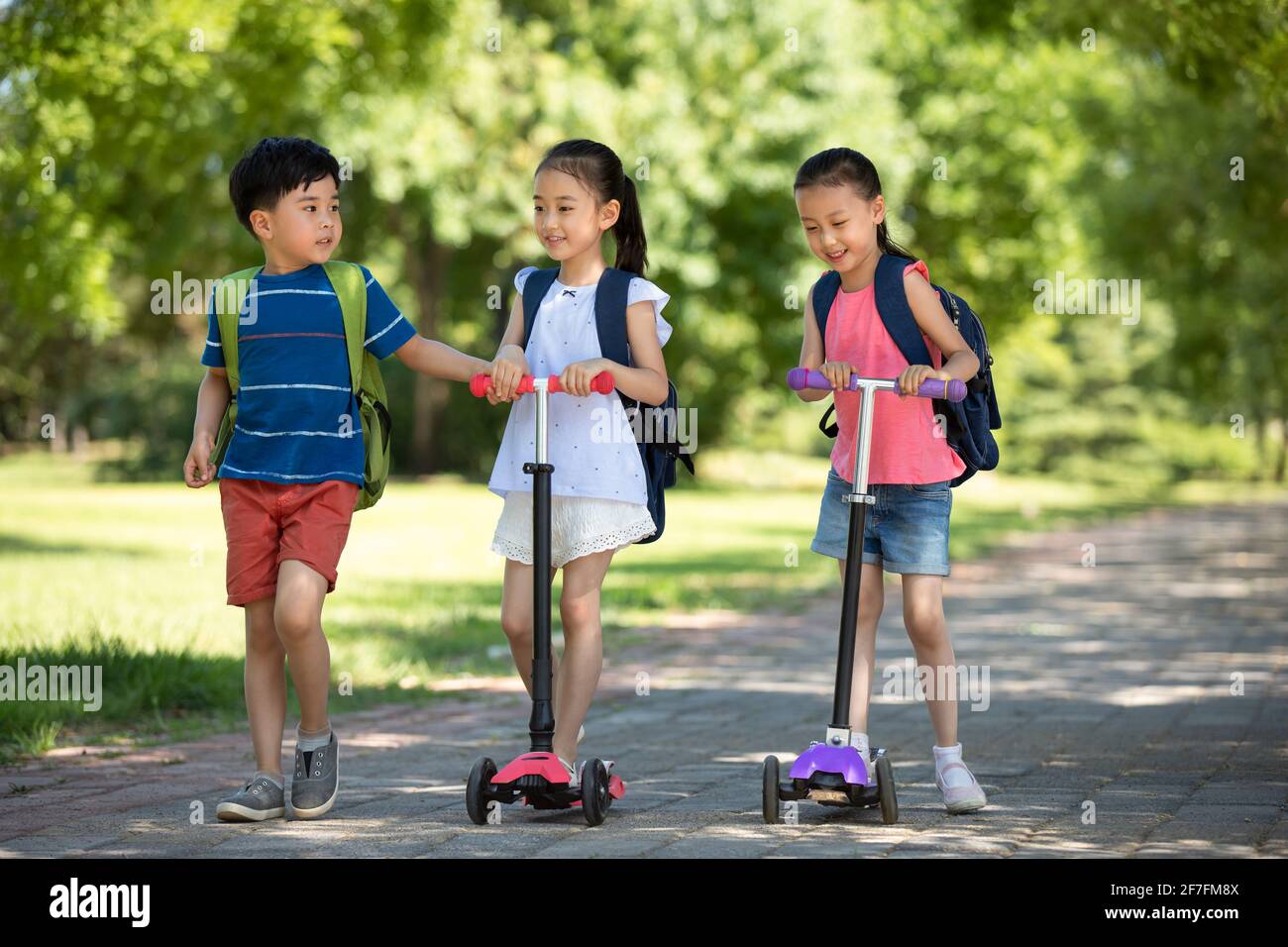 Happy children going to school Stock Photo - Alamy