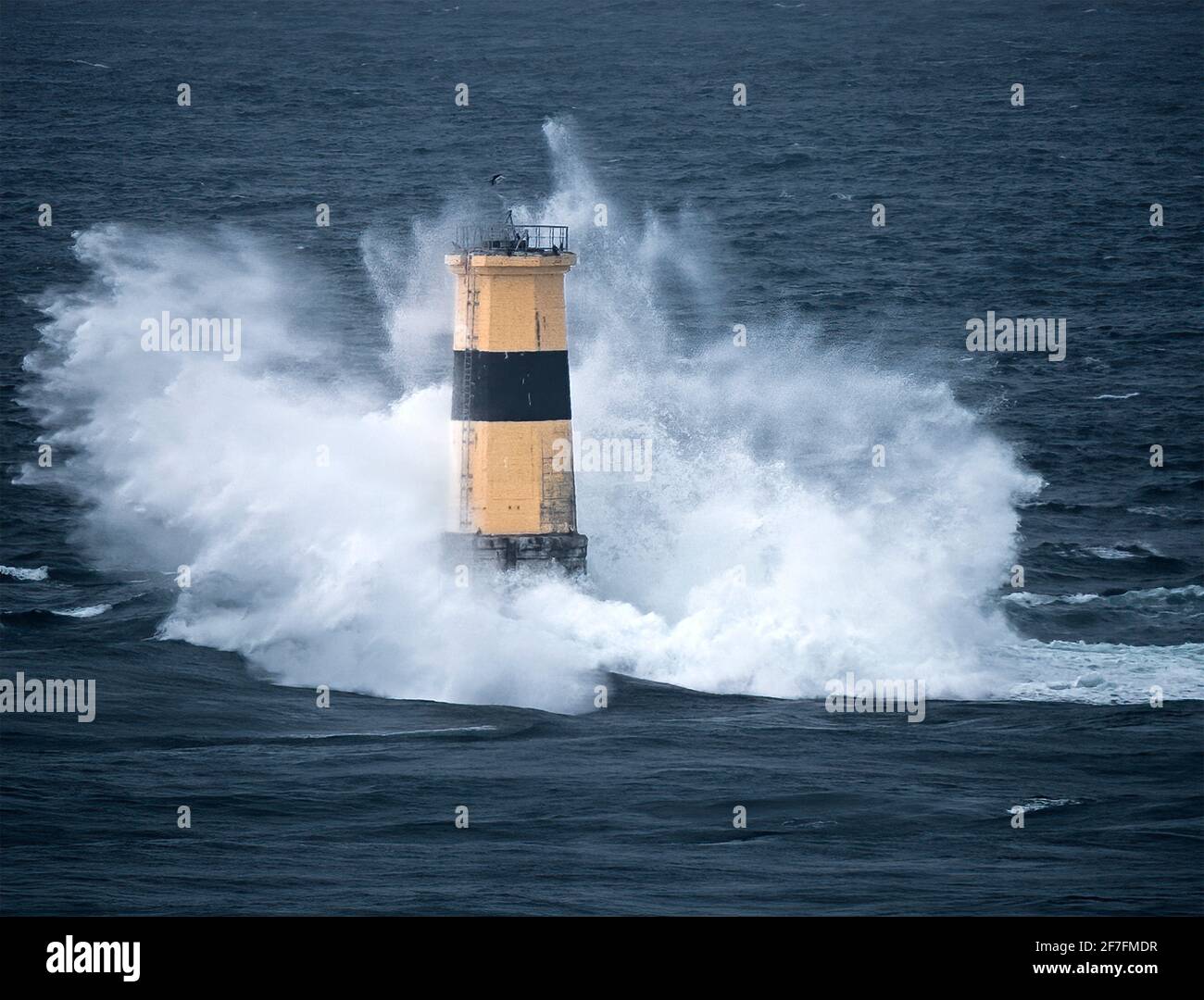 Waves crash on Tourelle de la Plate Lighthouse, Pointe du Raz ...