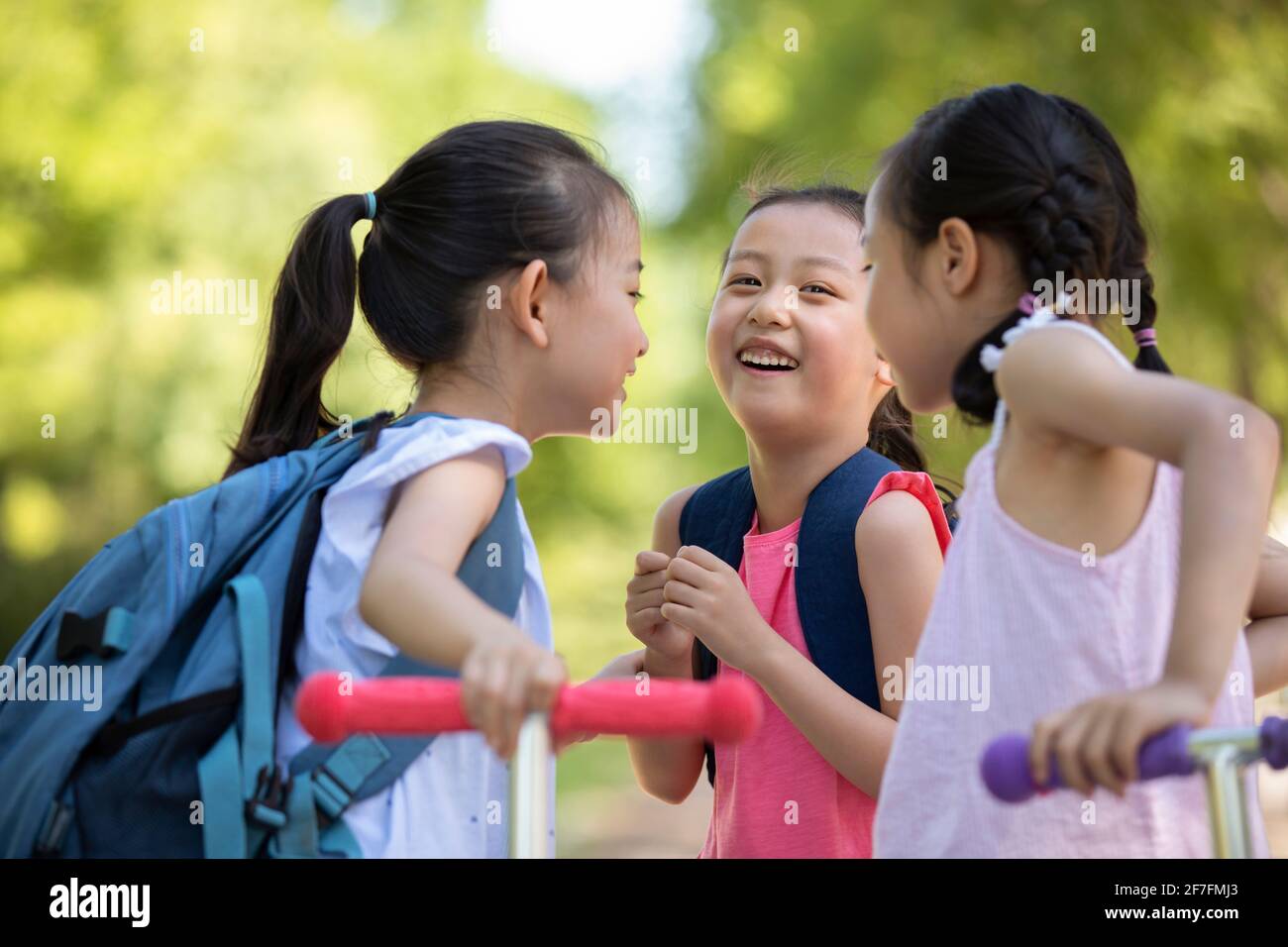 Happy children playing outdoors Stock Photo - Alamy