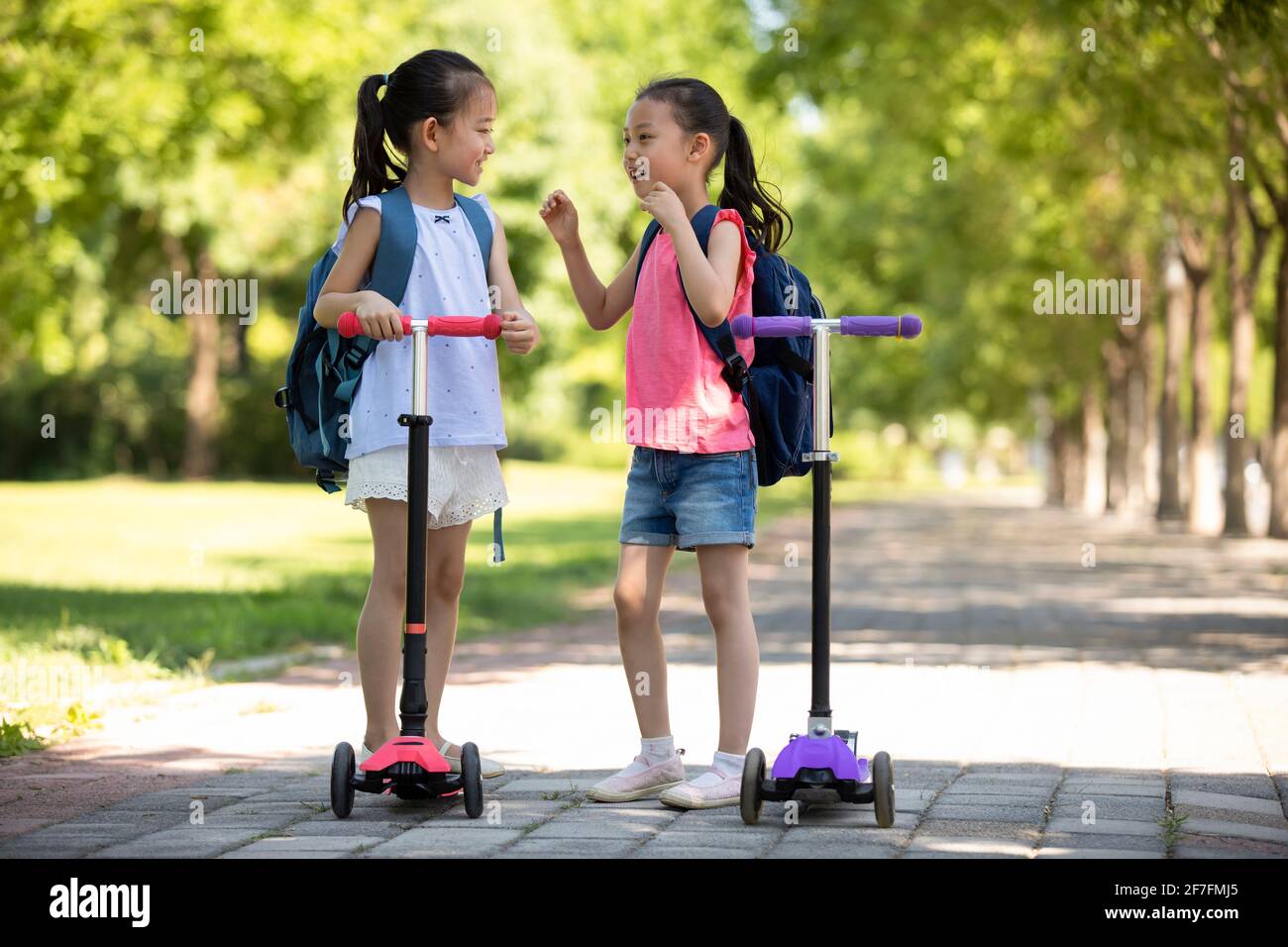 Happy children playing outdoors Stock Photo - Alamy