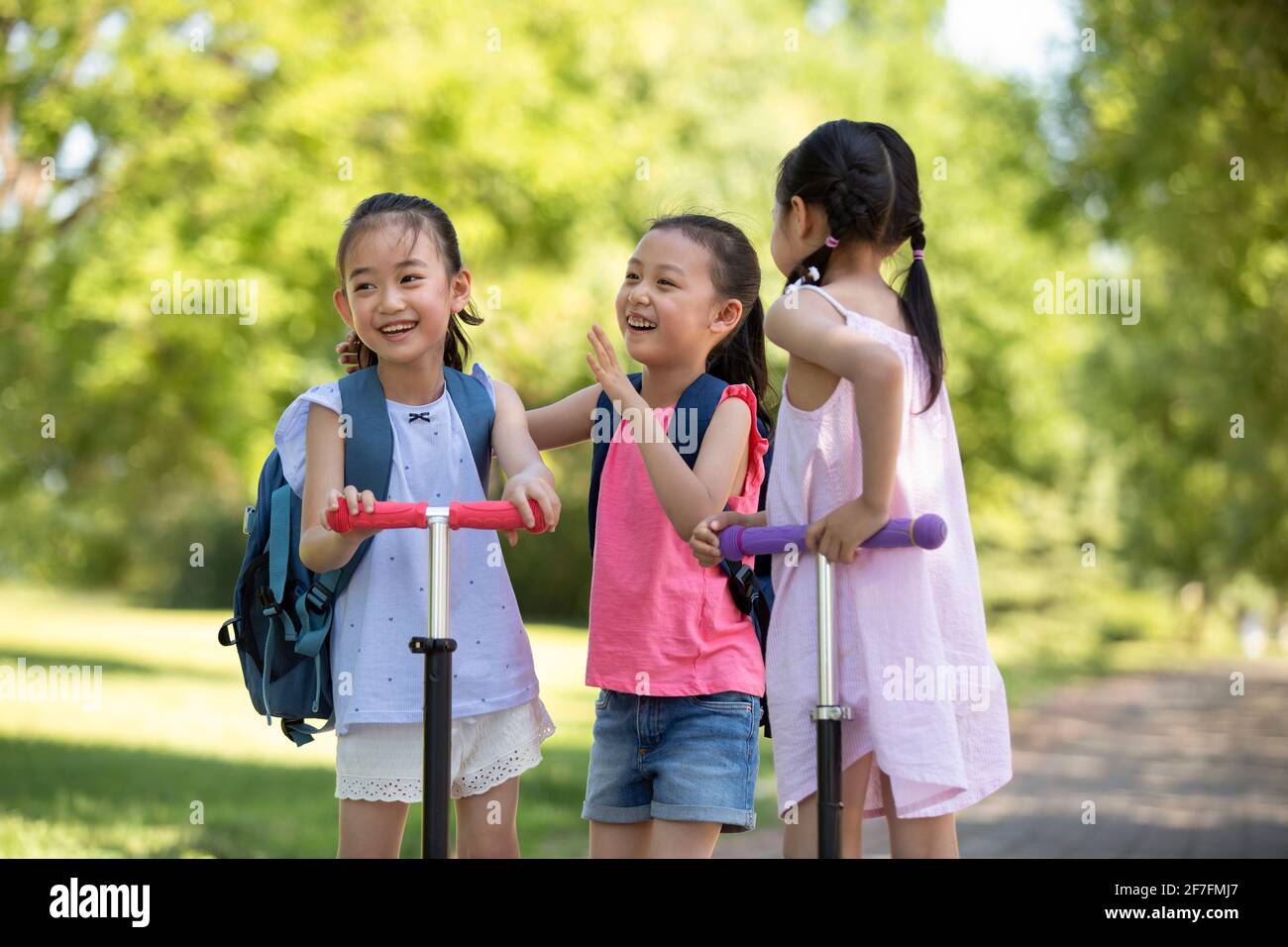Happy children playing outdoors Stock Photo - Alamy