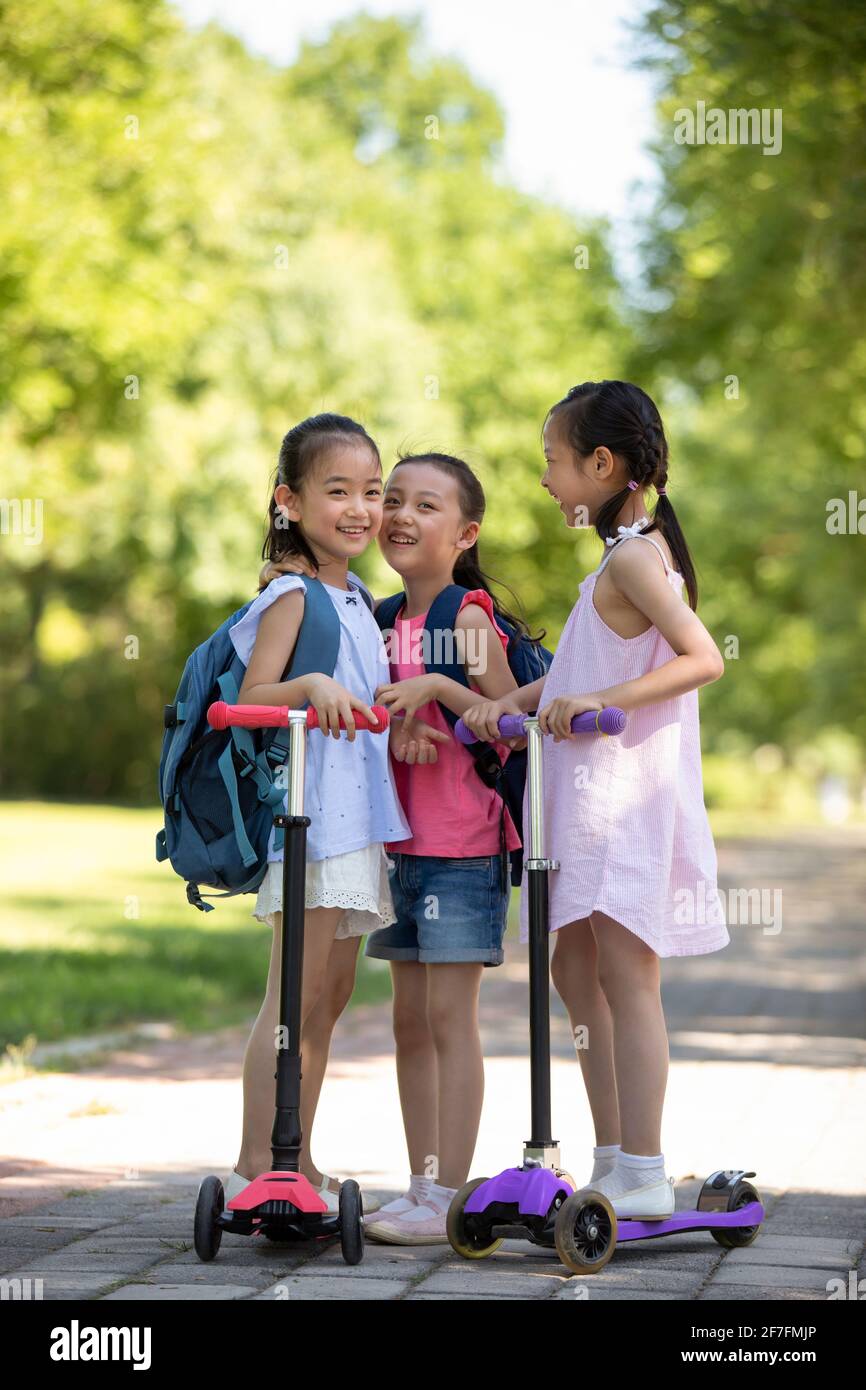 Happy children playing outdoors Stock Photo - Alamy