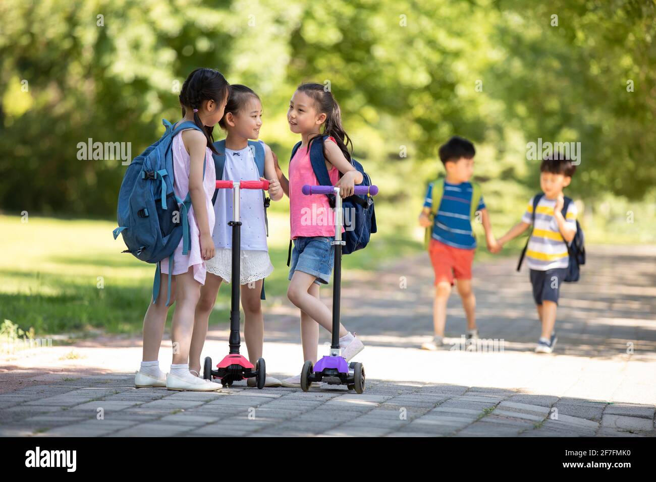 Happy children going to school Stock Photo - Alamy