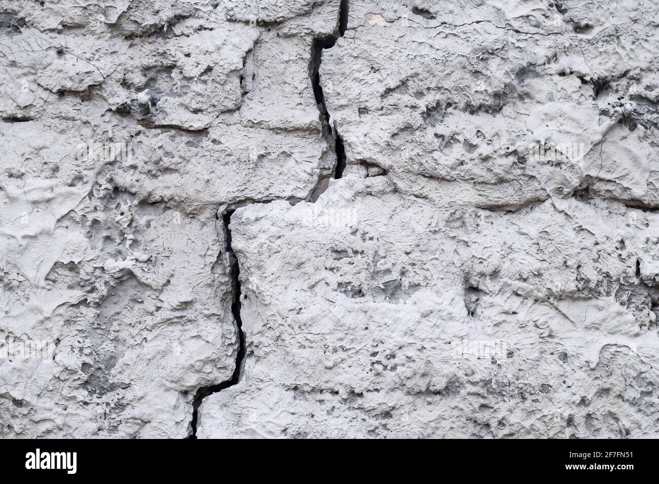 Cracked concrete wall, gray grunge texture. Destroyed cement old wall, abstract background ...
