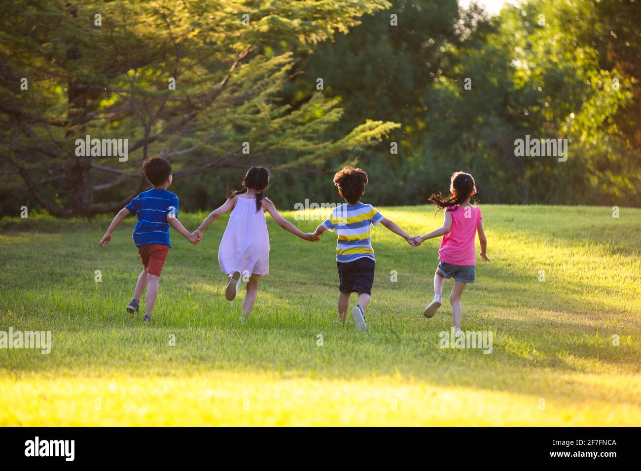 Child running looking back rear view hi-res stock photography and ...