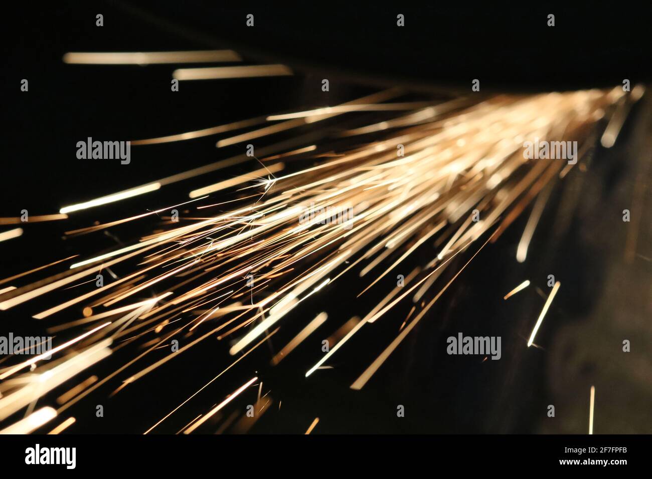 flying sparks from a grinder Stock Photo - Alamy