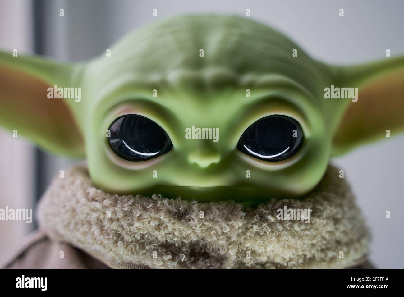 April, 2021: Head of baby Grogu, baby Yoda close-up. Realistic toy ...