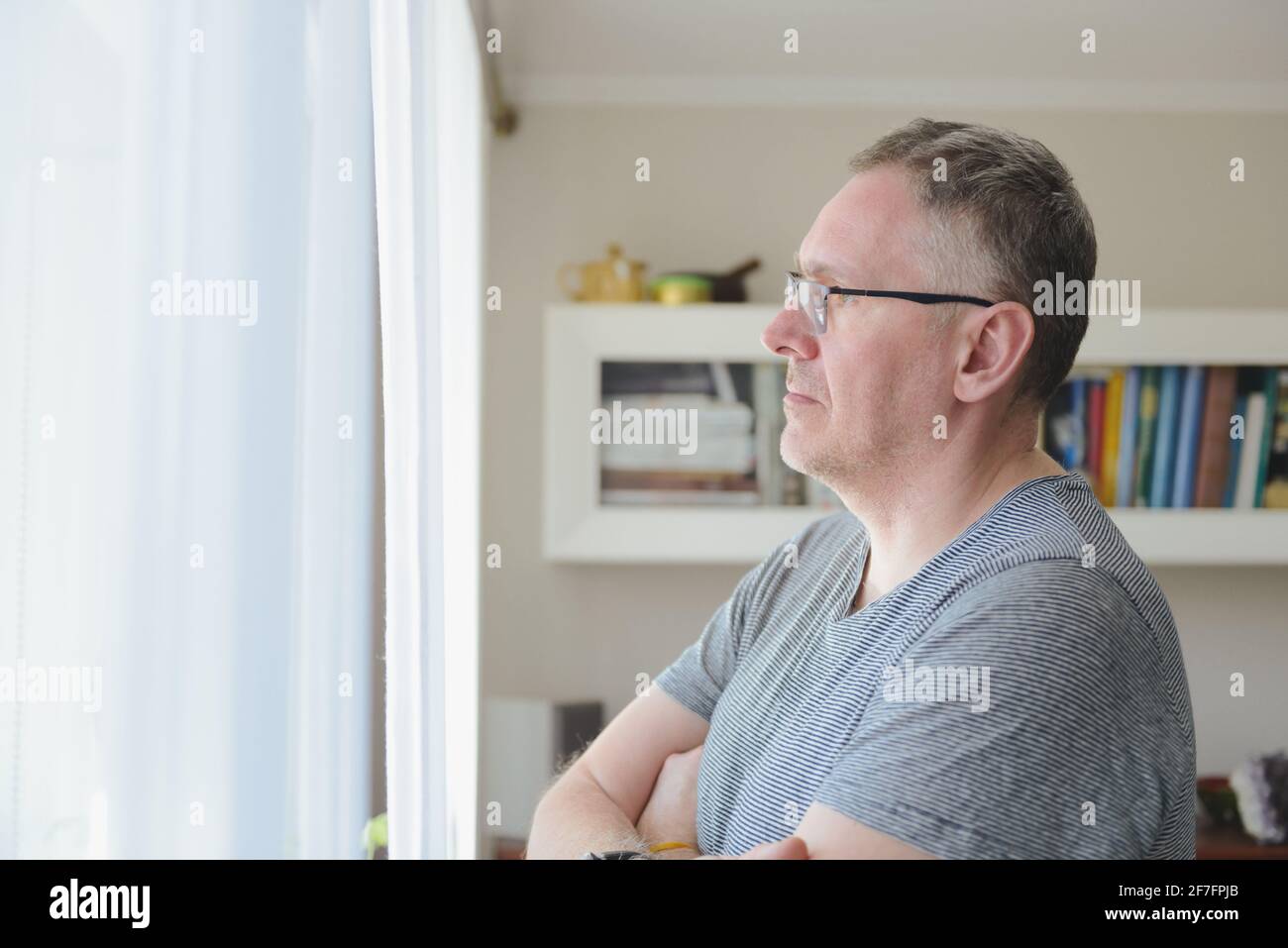 Single man suffers from loneliness or depression. The man is standing ...