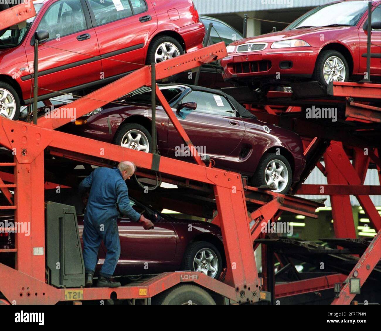 LONGBRIDGE ROVER FACTORY, BIRMINGHAM A WORKER LOADING CARS TO LEAVE THE ...