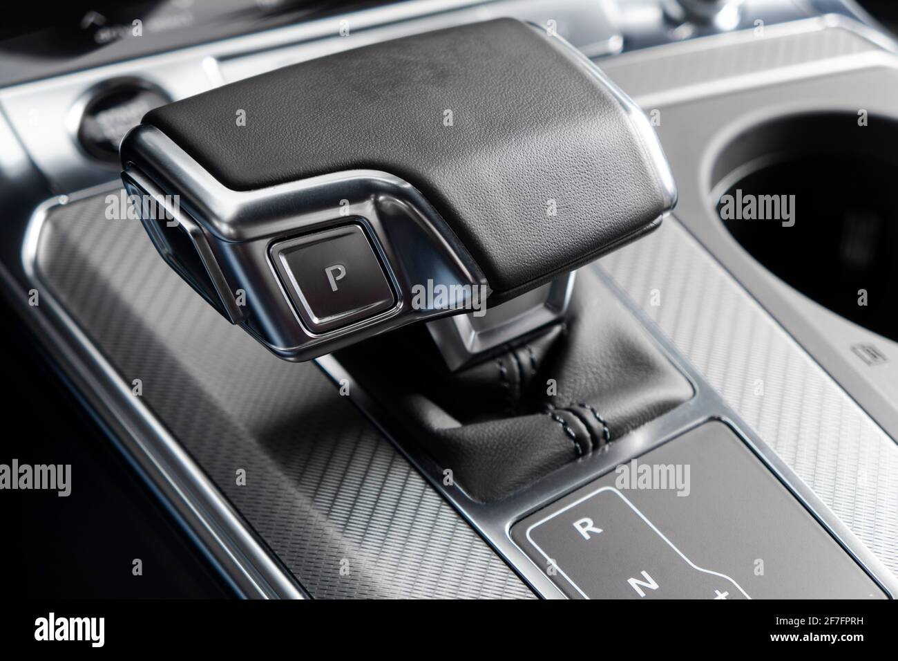 Automatic gear stick of a modern car. Modern car interior details ...