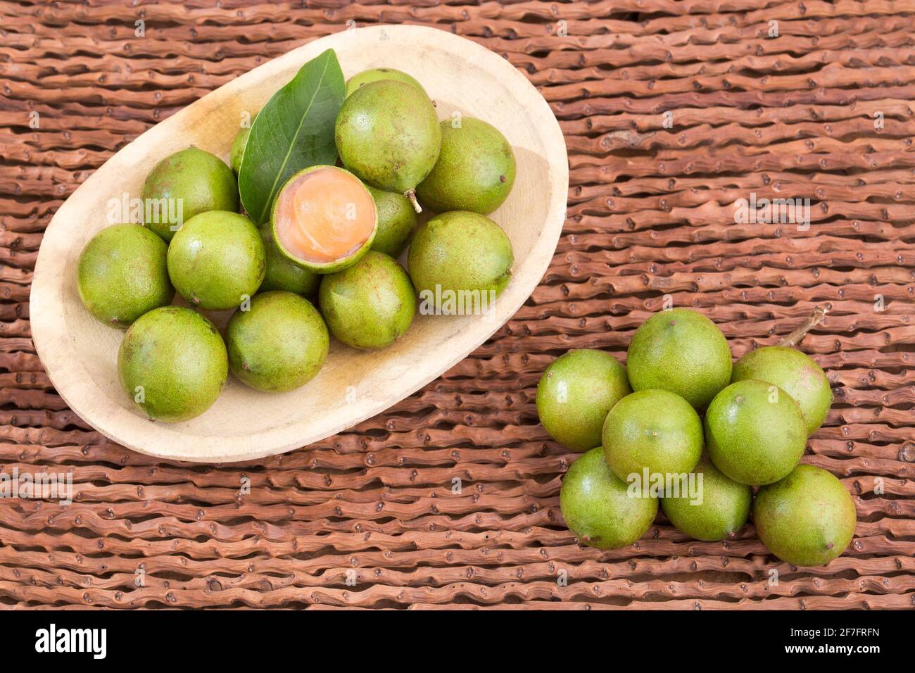 Fresh ripe peeled quenepa fruit - Melicoccus bijugatus Stock Photo - Alamy