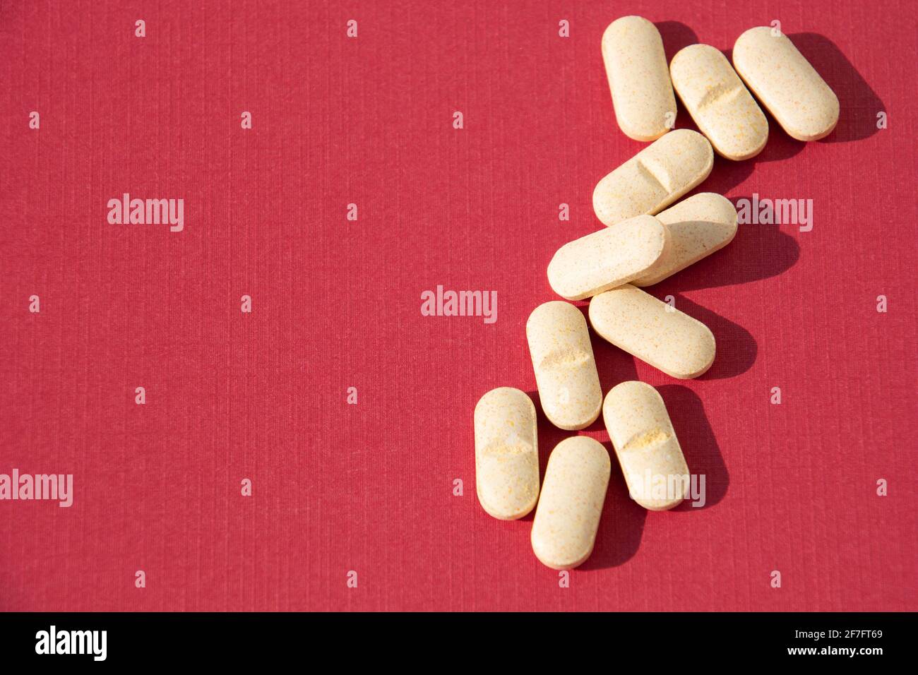 vitamin b pills on red colored paper background with copy space Stock ...