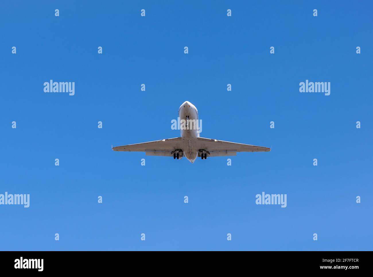 Business jet on short final landing Stock Photo - Alamy