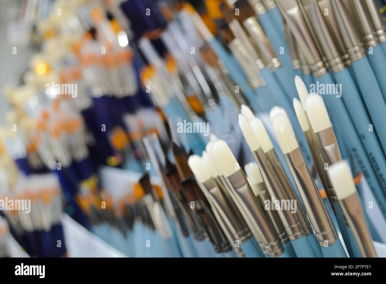 Close-up of different brushes for drawing blue with white and red ...