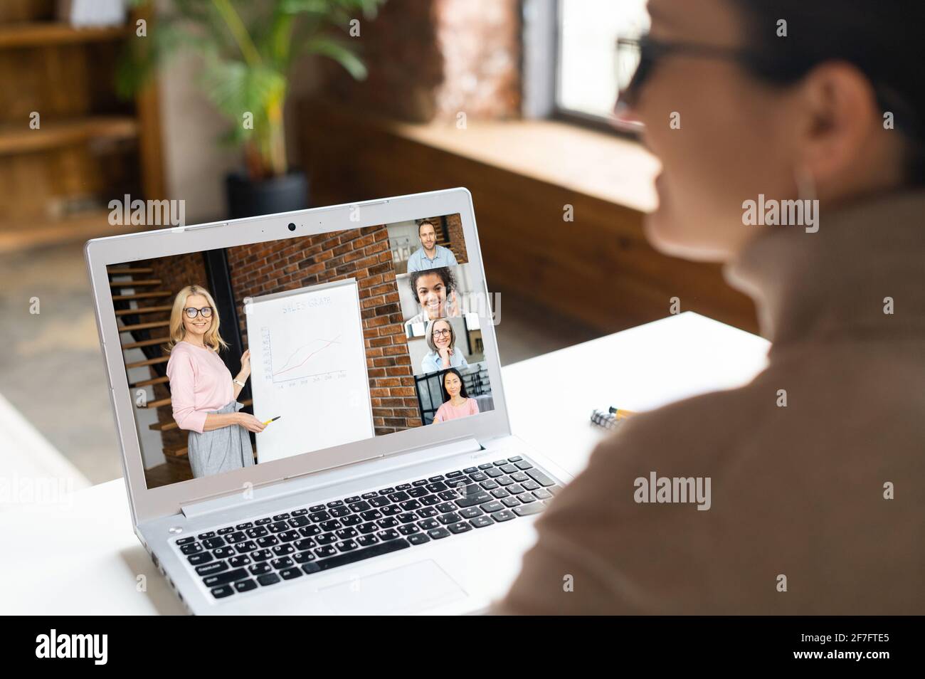 Female student learning online at home, watching webinar, online ...