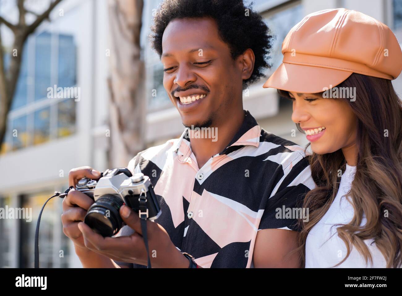 Tourist couple using camera outdoors Stock Photo - Alamy